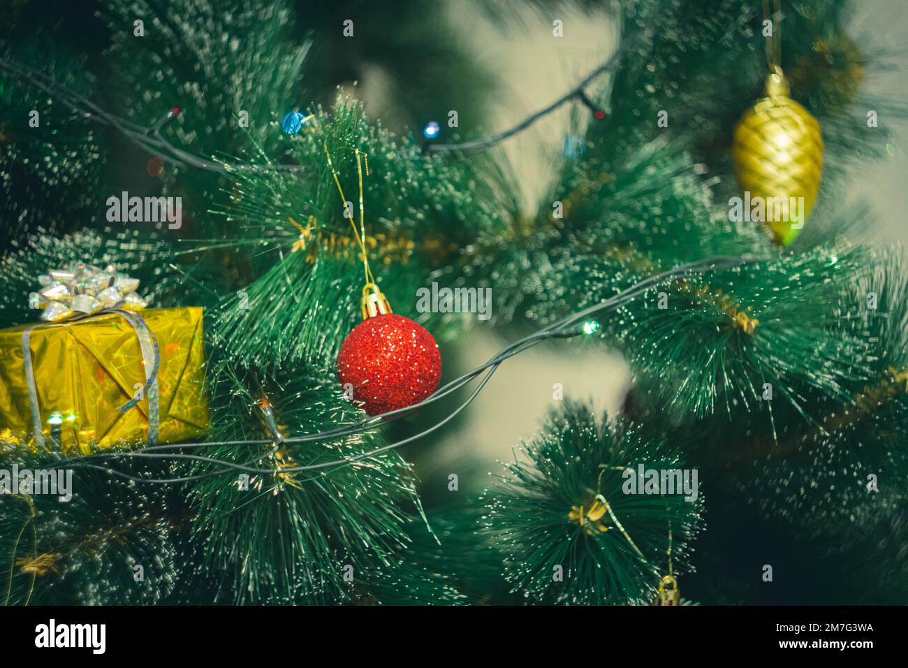 Christmas decorations and colored lights garlands on Christmas tree ...