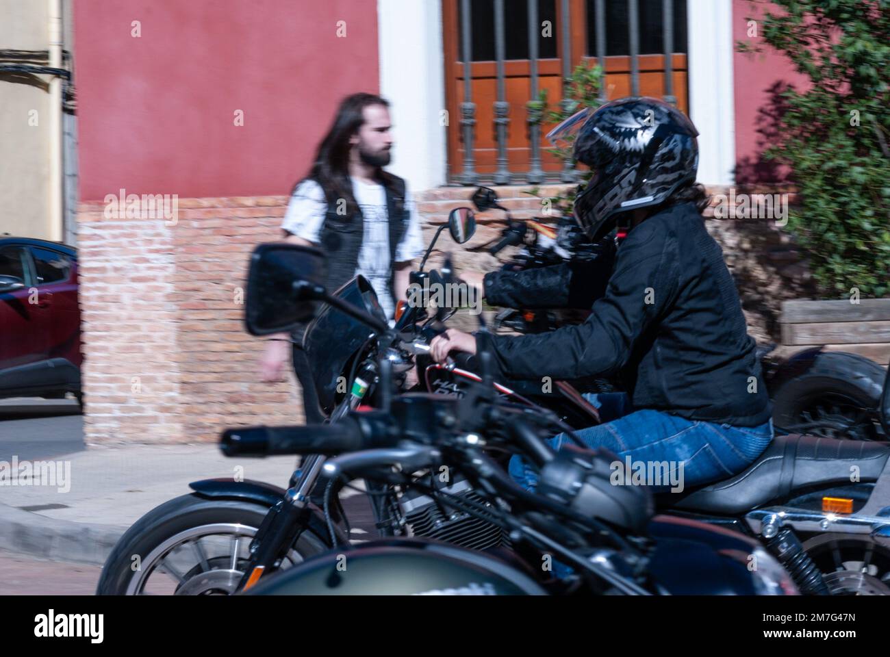 Photo of bikers, with their motorcycles representing the biker custom ...