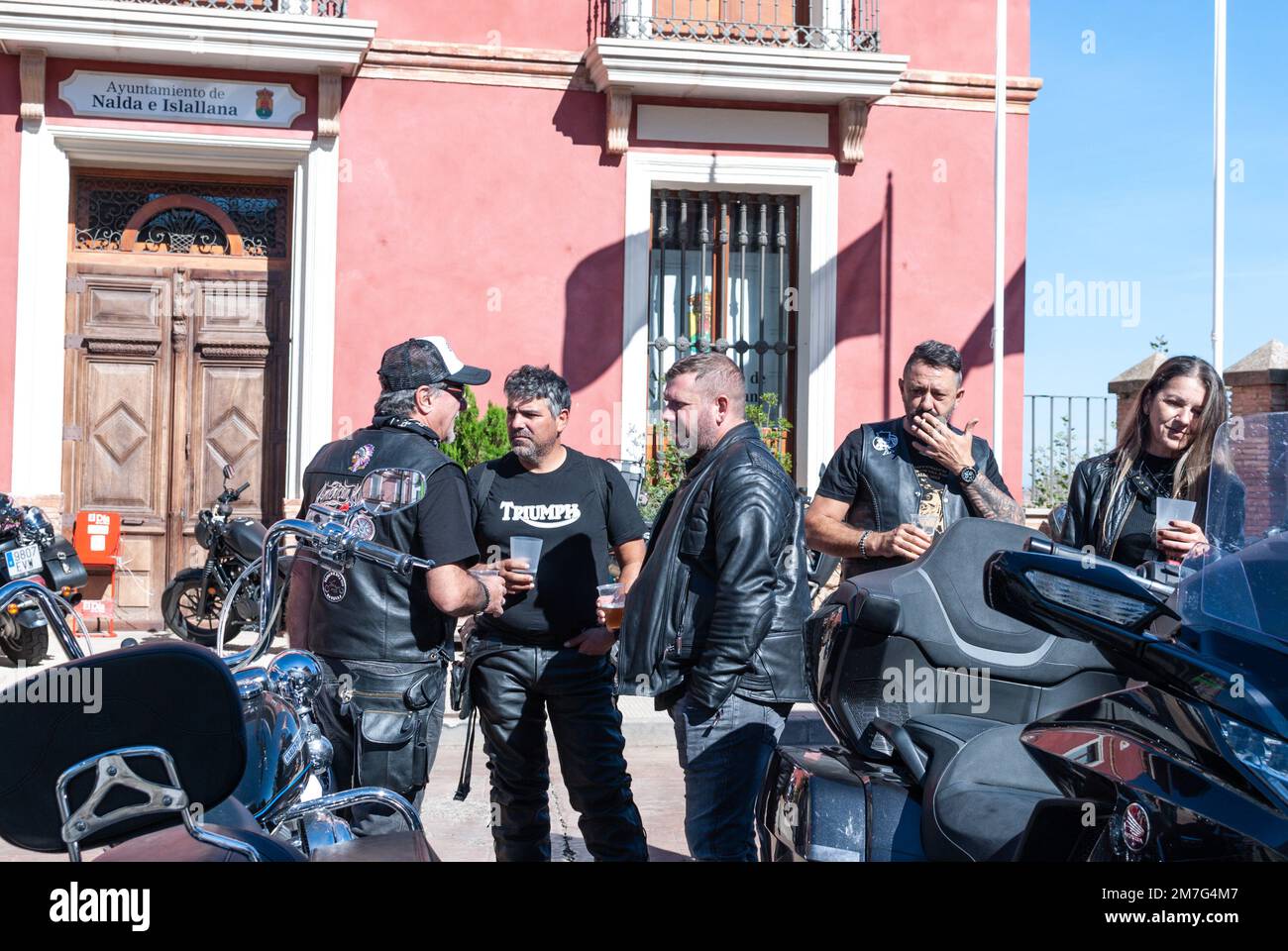 Photo of bikers, with their motorcycles representing the biker custom ...