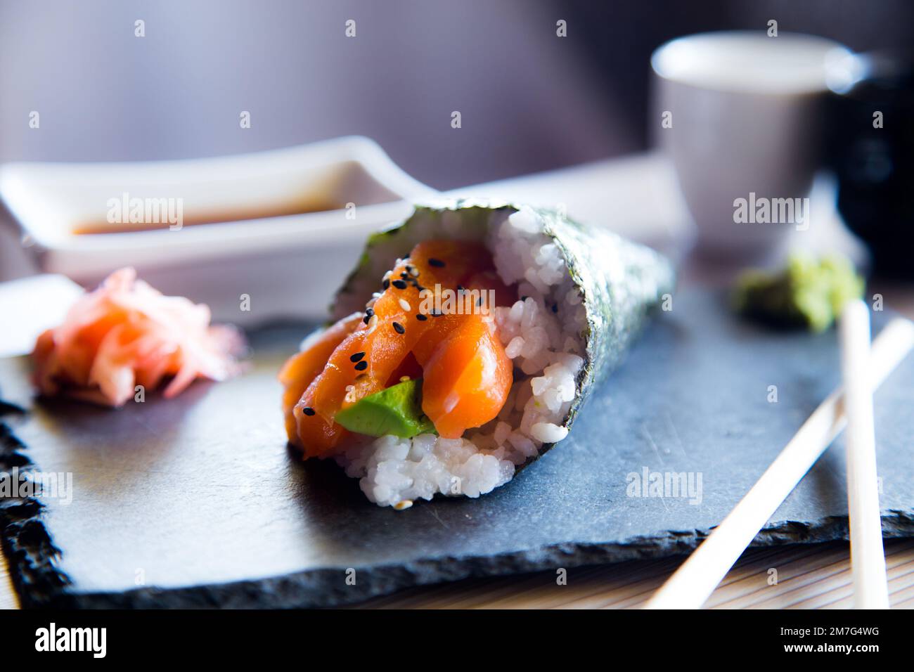Salmon temaki. Temakis are cone-shaped pieces of sushi made of nori ...