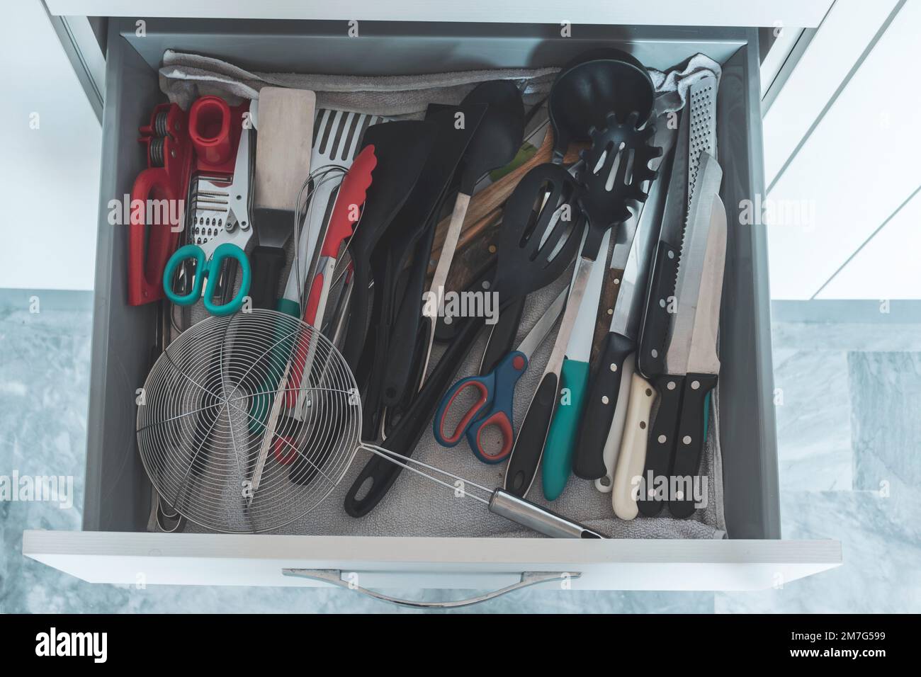 Top view of a kitchen drawer full of utensils. Concept of minimalism ...