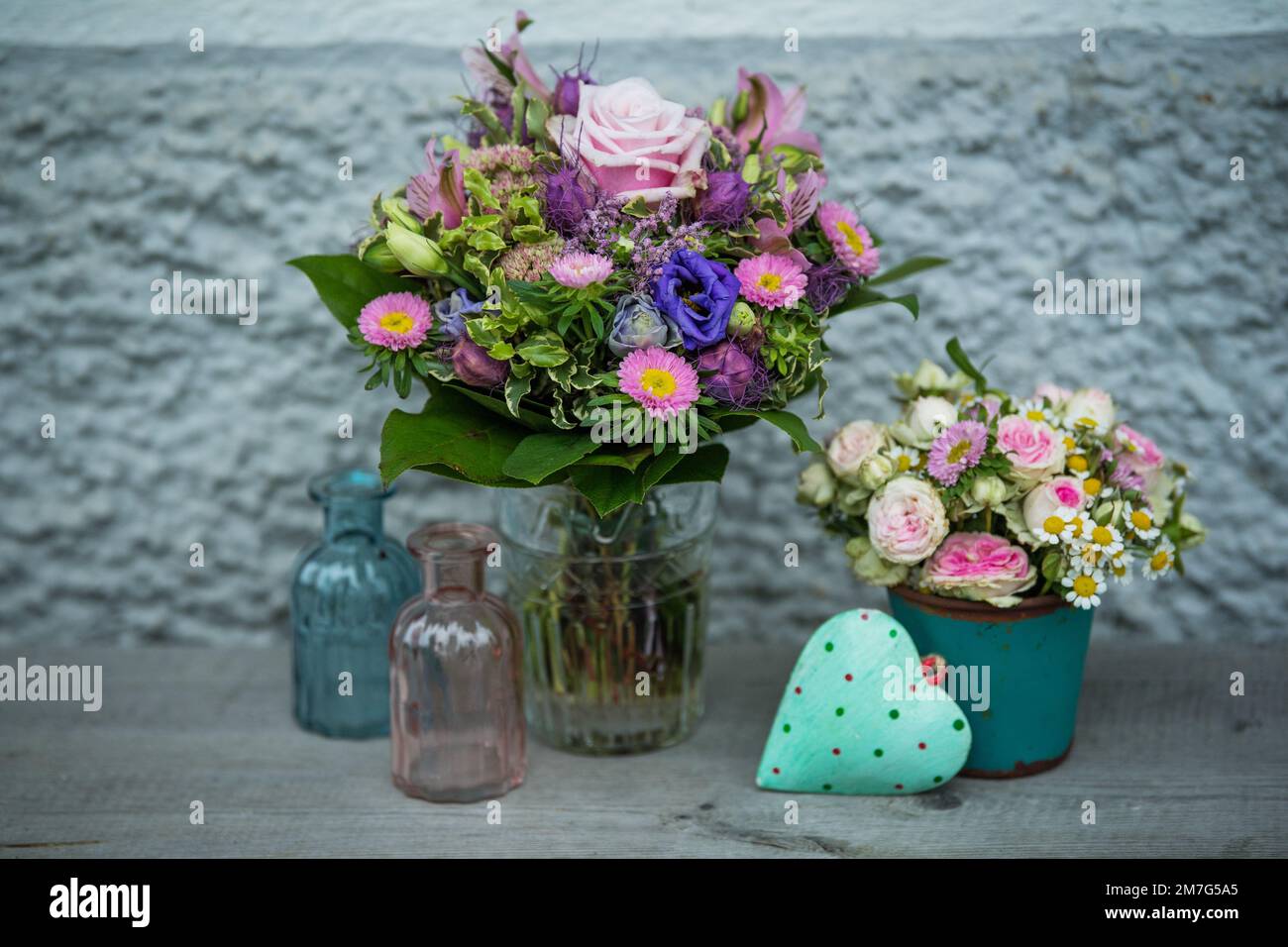 Little flower bouquet with pink roses and a heart Stock Photo - Alamy