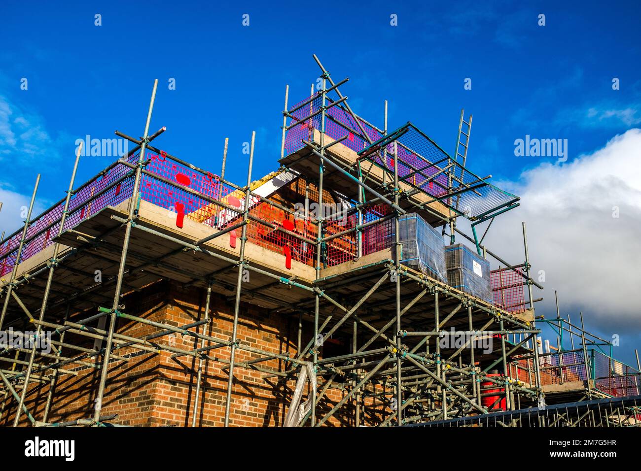 Scaffolding in use in construction of a new house Stock Photo - Alamy