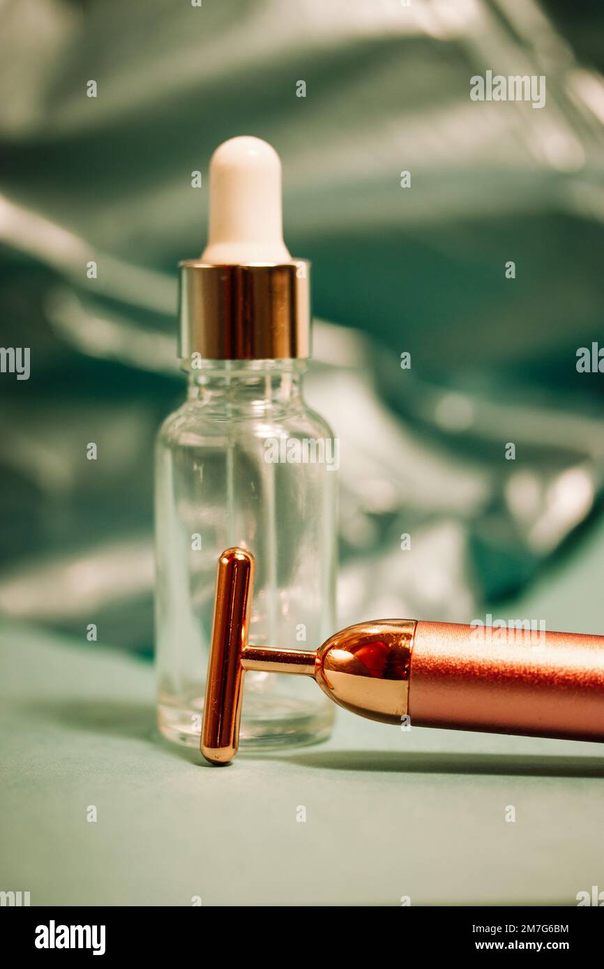 Vibrating golden facial massager, oil dropper for massage olive green ...