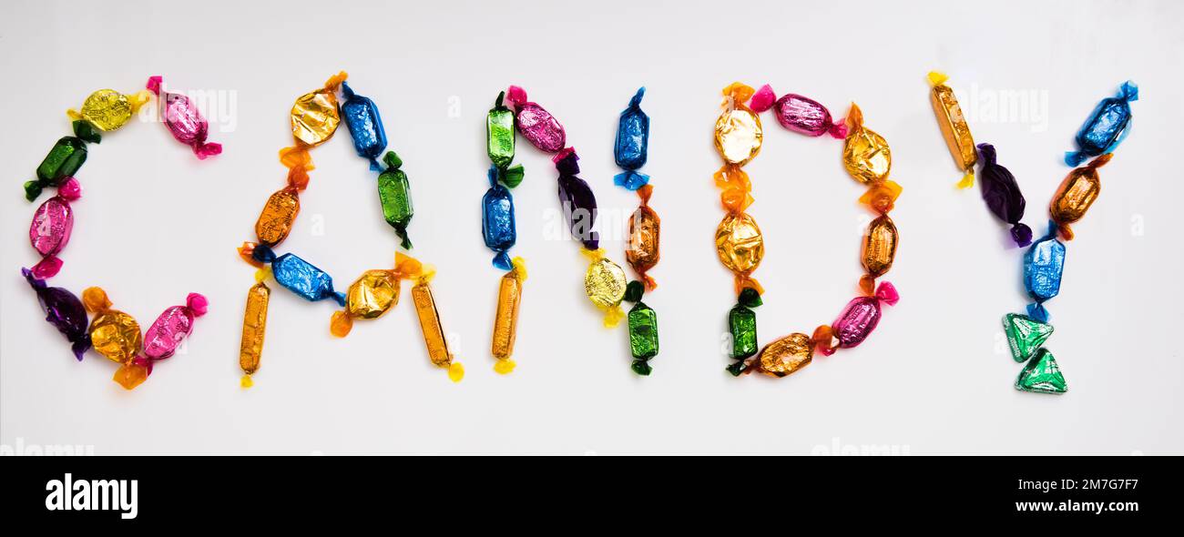 Word Candy made from candies of different colours Stock Photo - Alamy