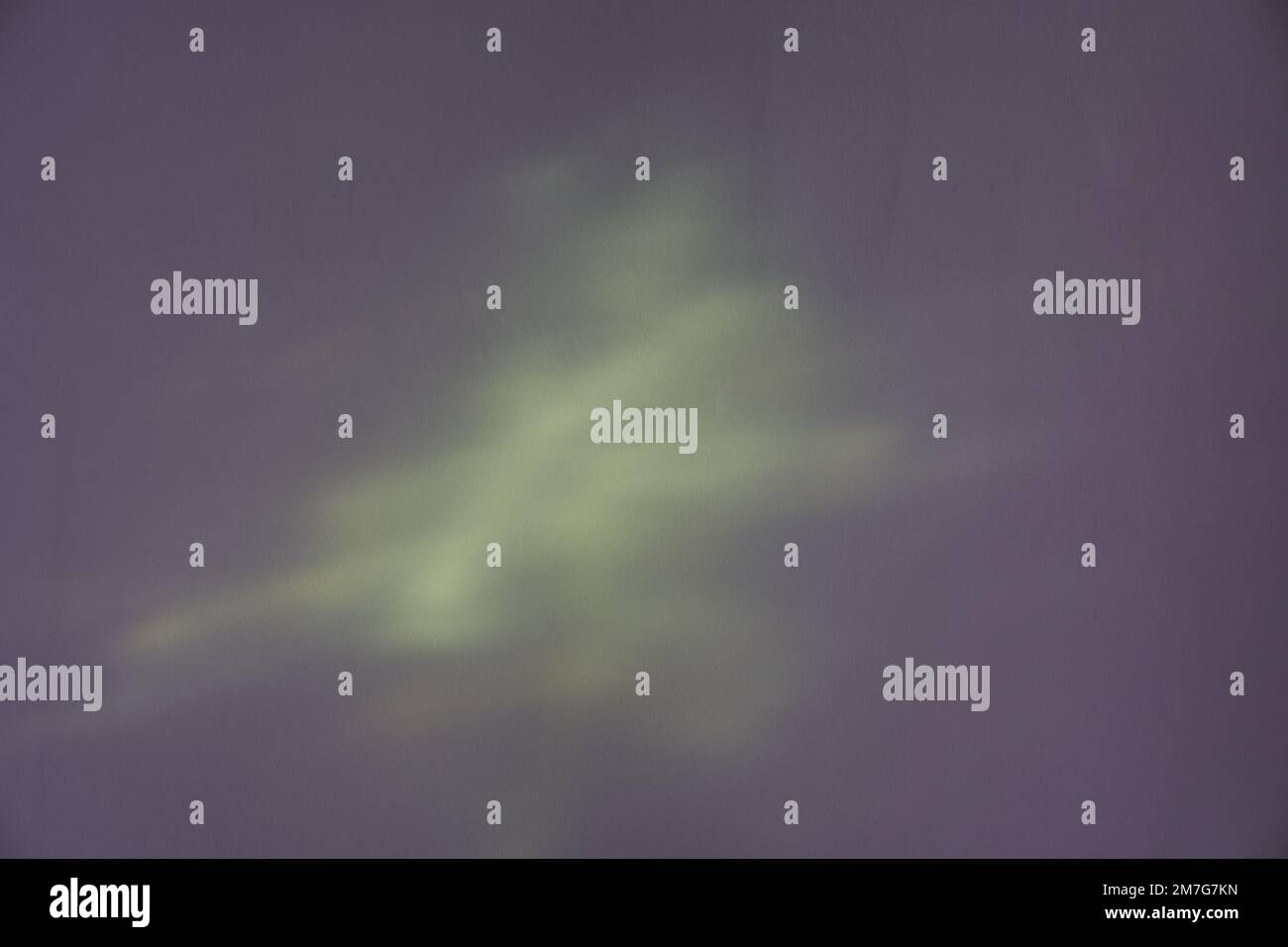 The blurred glare from the foil on the texture of the paper. Abstract ...