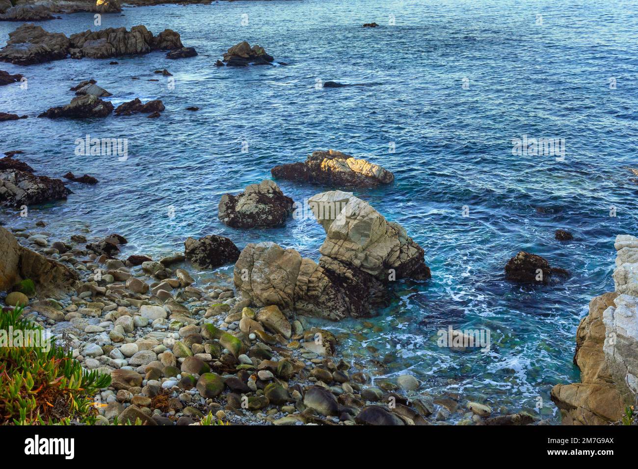 Boulders and rocks on the shoreline of Monterey Bay in California Stock ...