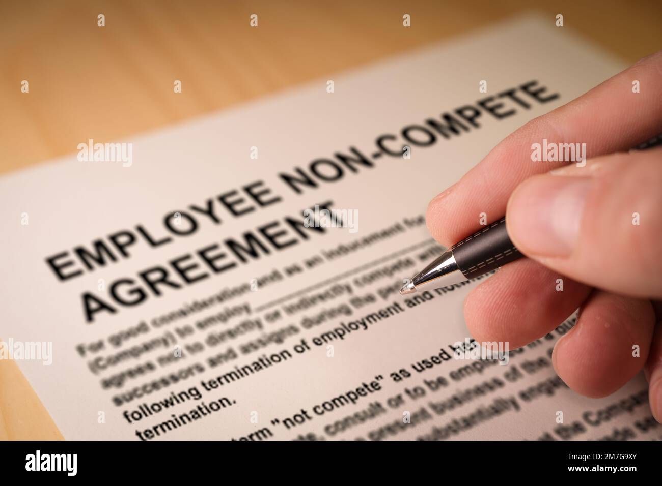 Man signing an employee Non-compete agreement Stock Photo - Alamy