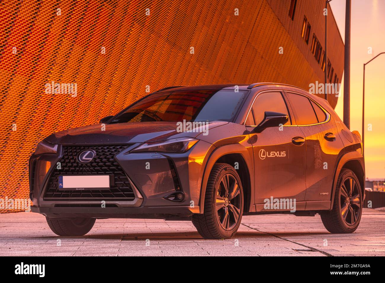 Lexus UX hybrid SUV against the background of a modern building in the ...