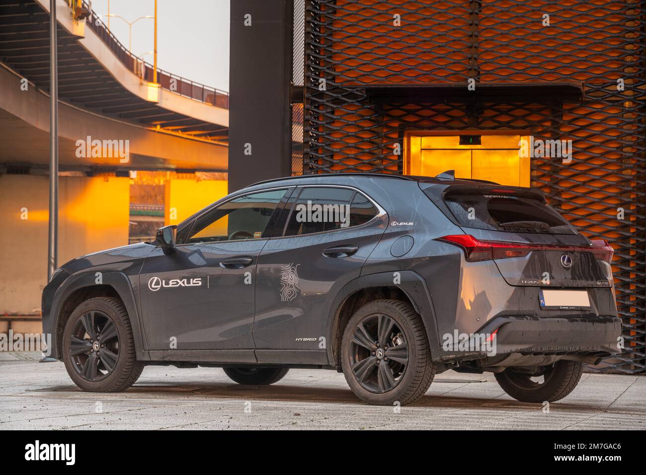Lexus UX hybrid SUV against the background of a modern building in the ...