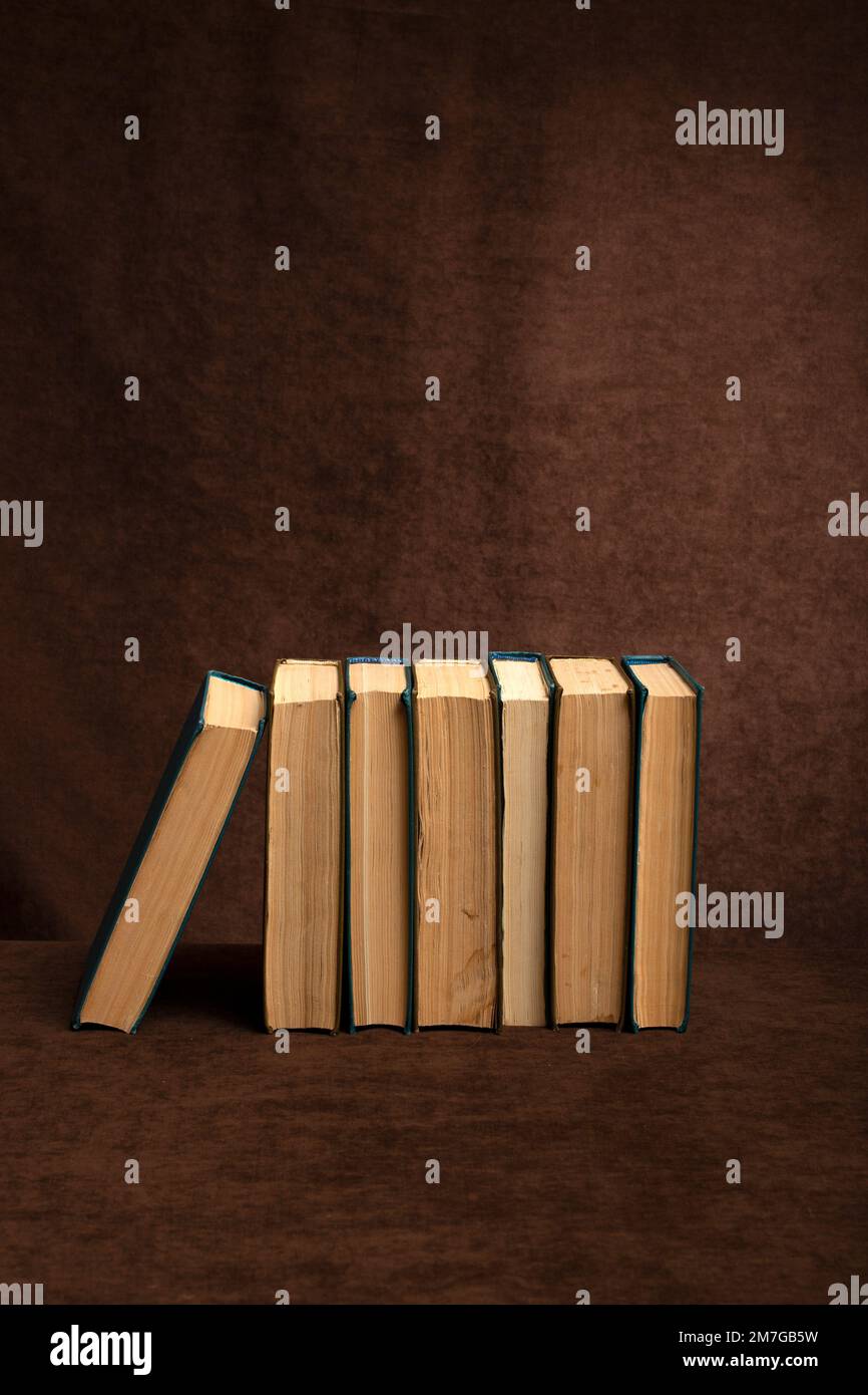 Still life with a stack of old books on the table Stock Photo - Alamy