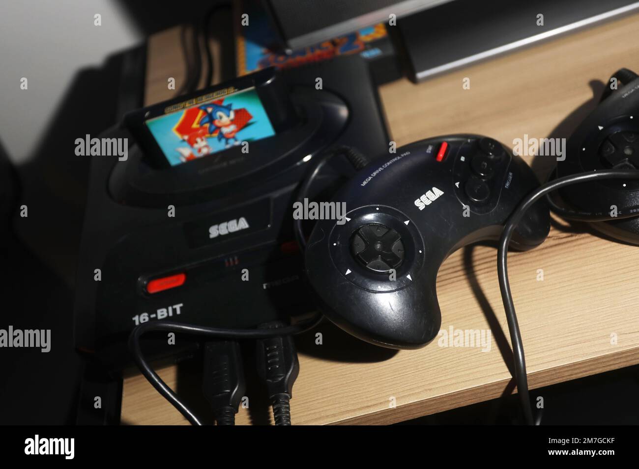 An old Sega Megadrive games console pictured connected up to a TV with ...
