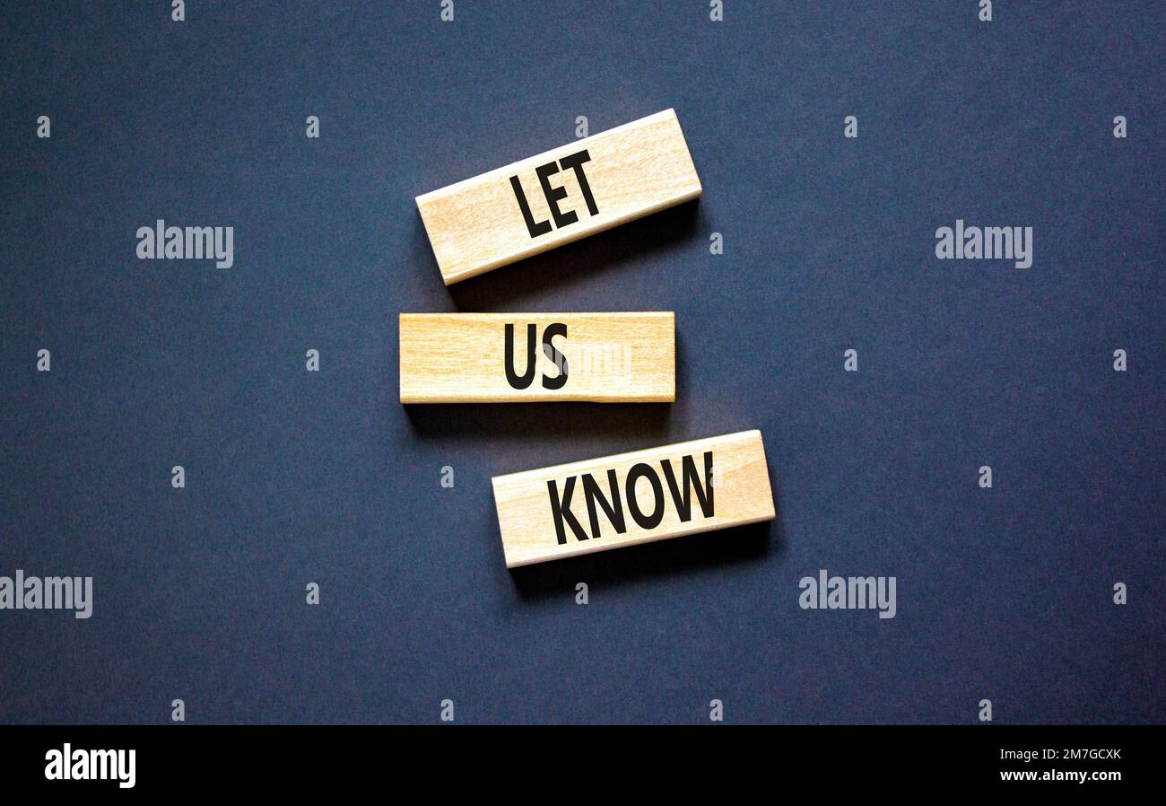 Let us know symbol. Concept words Let us know on wooden blocks on a ...