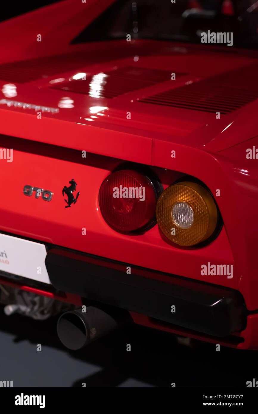 A closeup shot of the rear light of a red Ferrari 288 GTO 1984 at the ...