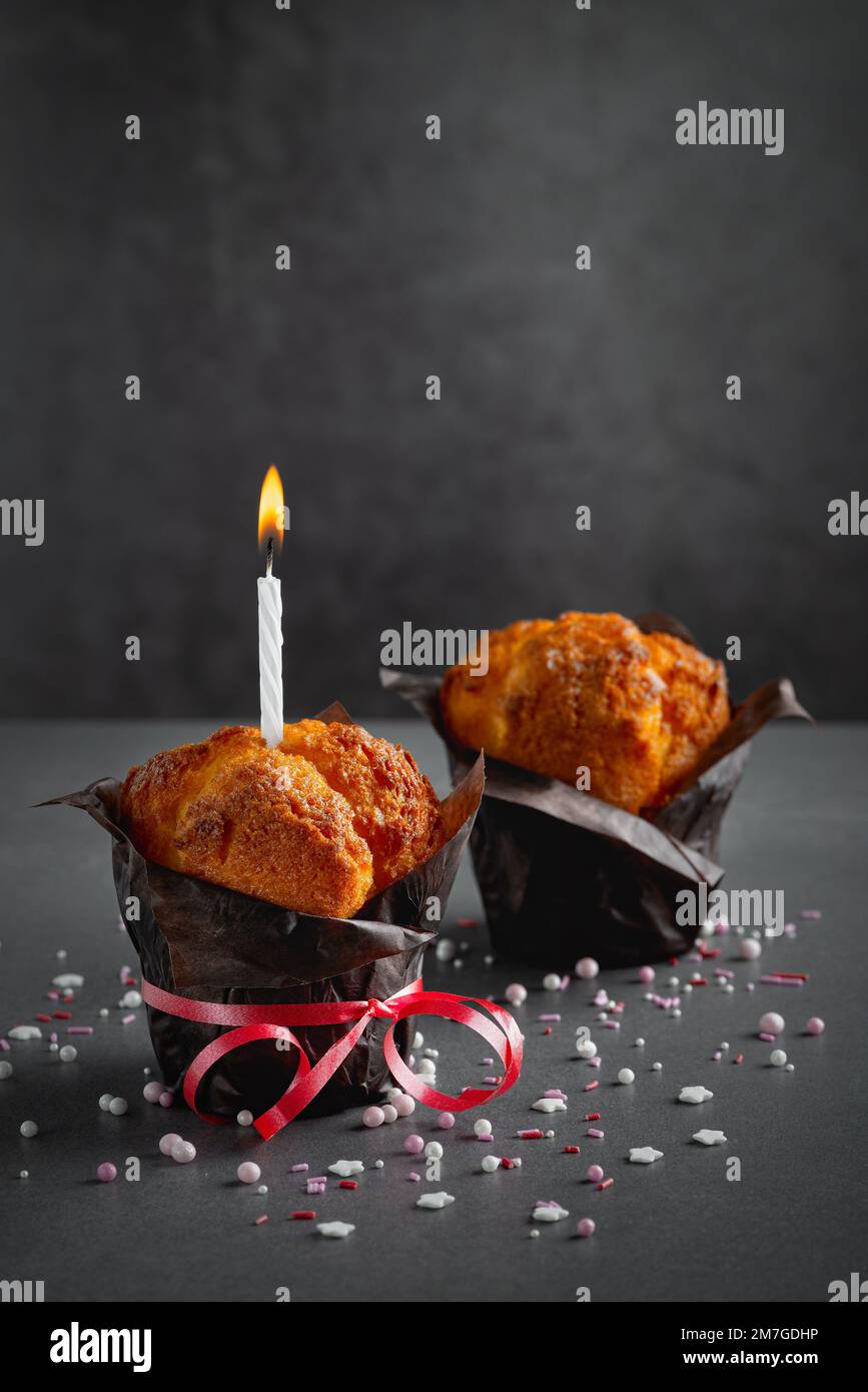 Birthday Muffin. Cupcake and pink ribbon, grey background with copy ...