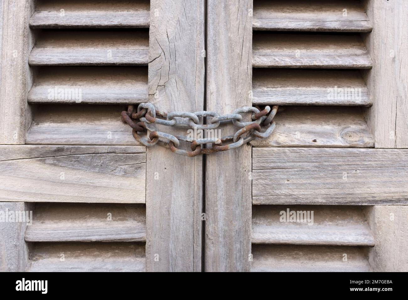 Locked old window shutters Stock Photo - Alamy