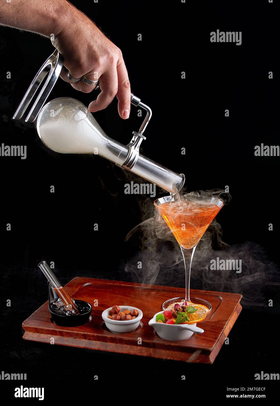 Preparation of an alcoholic cocktail, on a black background Stock Photo ...