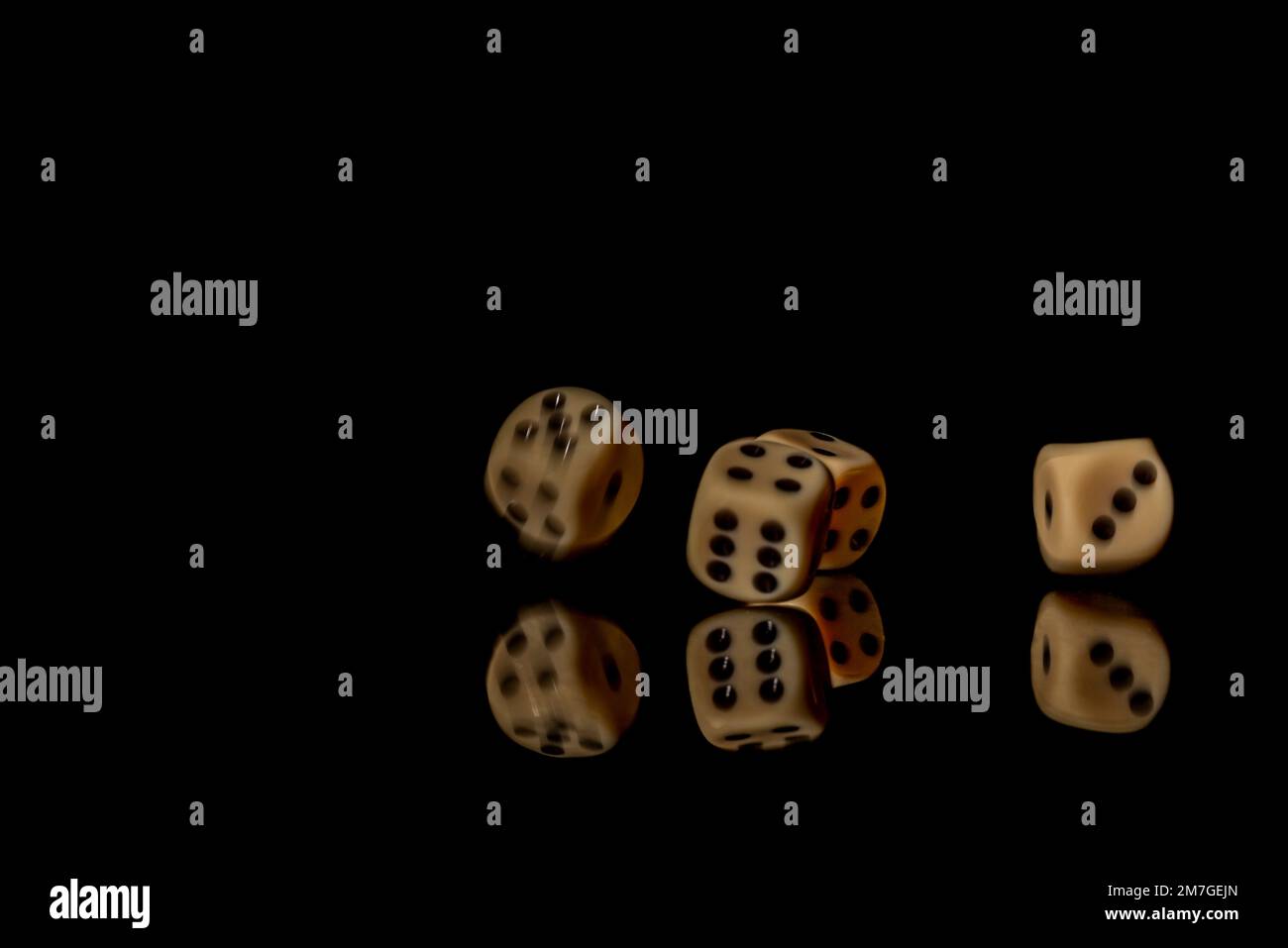Yellow game cubes on shiny black table with dark reflection Stock Photo ...