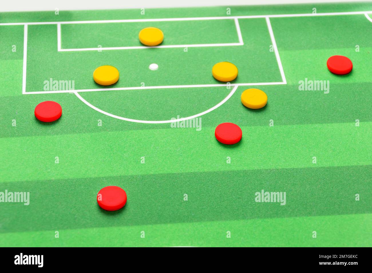 Close-up on a coach showing football players the line up on the field ...