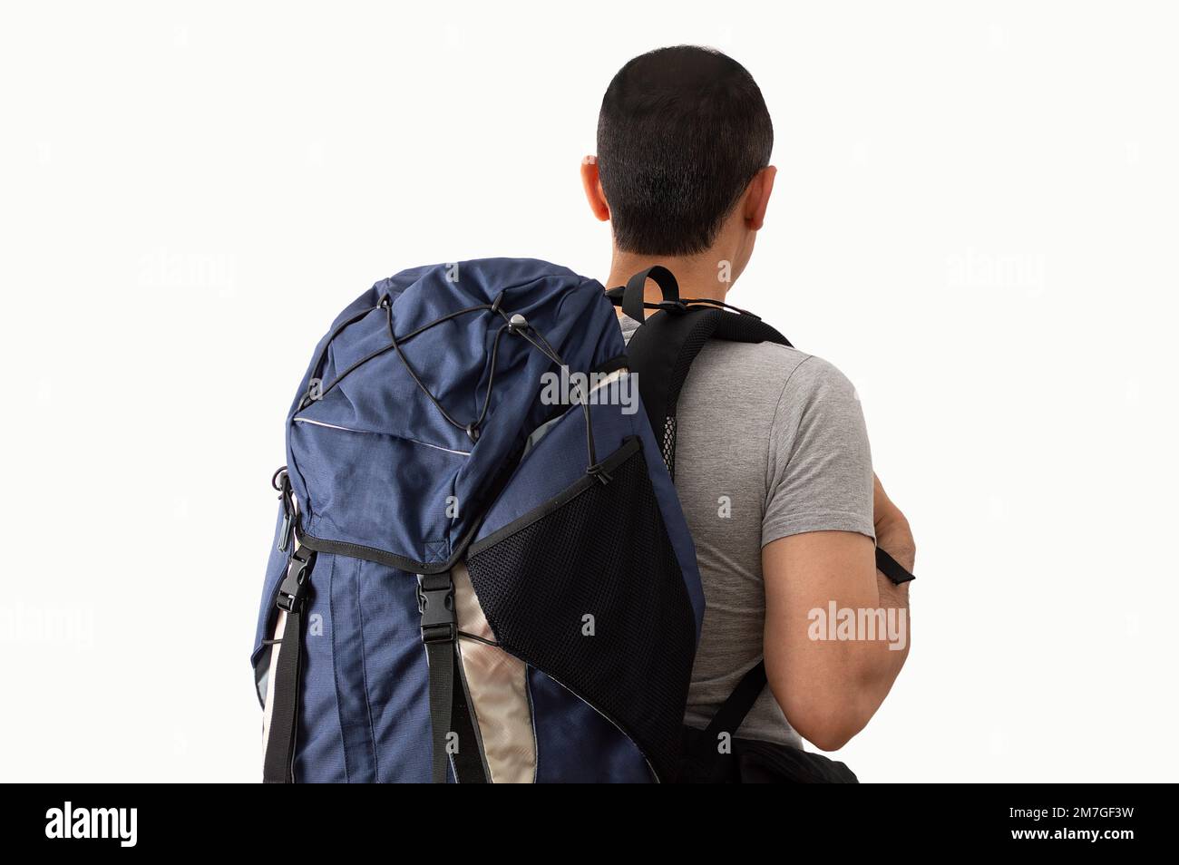 The back of the man with big blue backpack on the white background ...