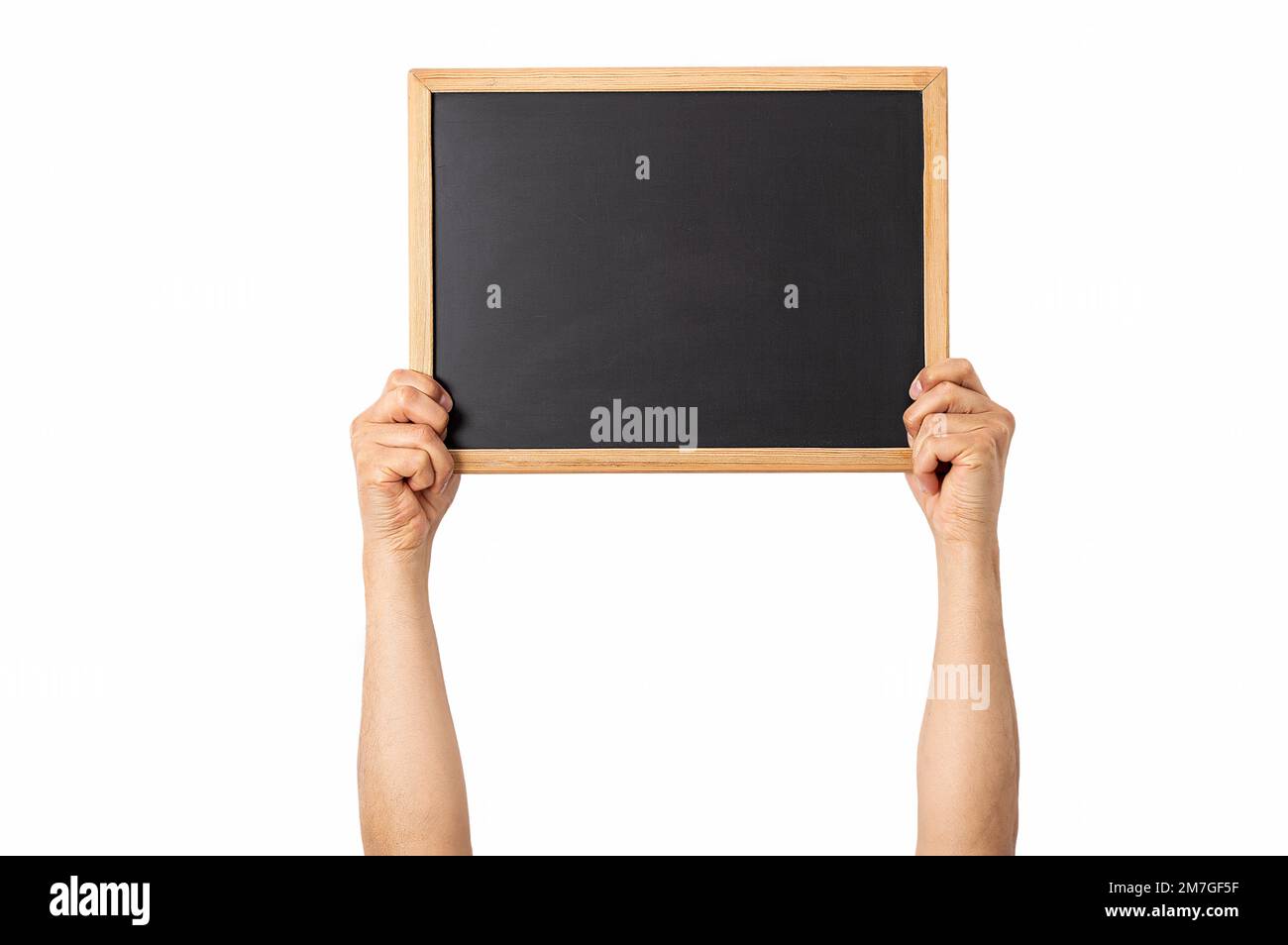 Man holding up small blackboard with white background and copy space ...