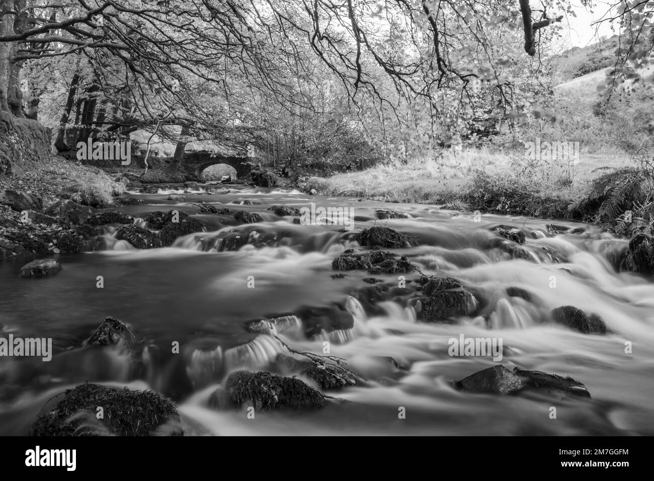 The Weir Water river flowing under Robbers Bridge in Exmoor National ...