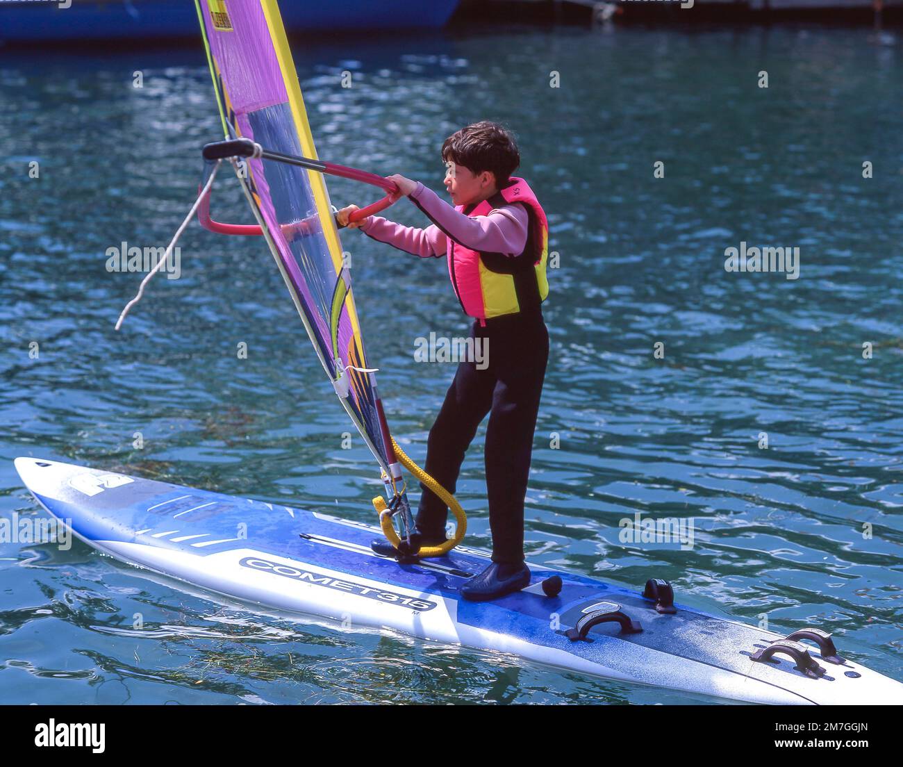 Young boy learning to windsurf on Lake Silvaplana (Silvaplanersee ...