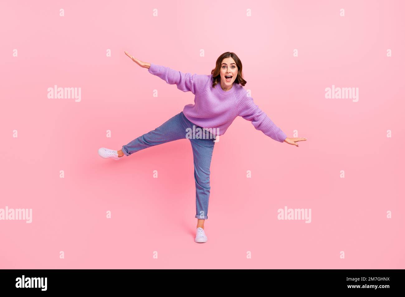 Full length photo of excited cute lady wear violet sweater dancing arms ...