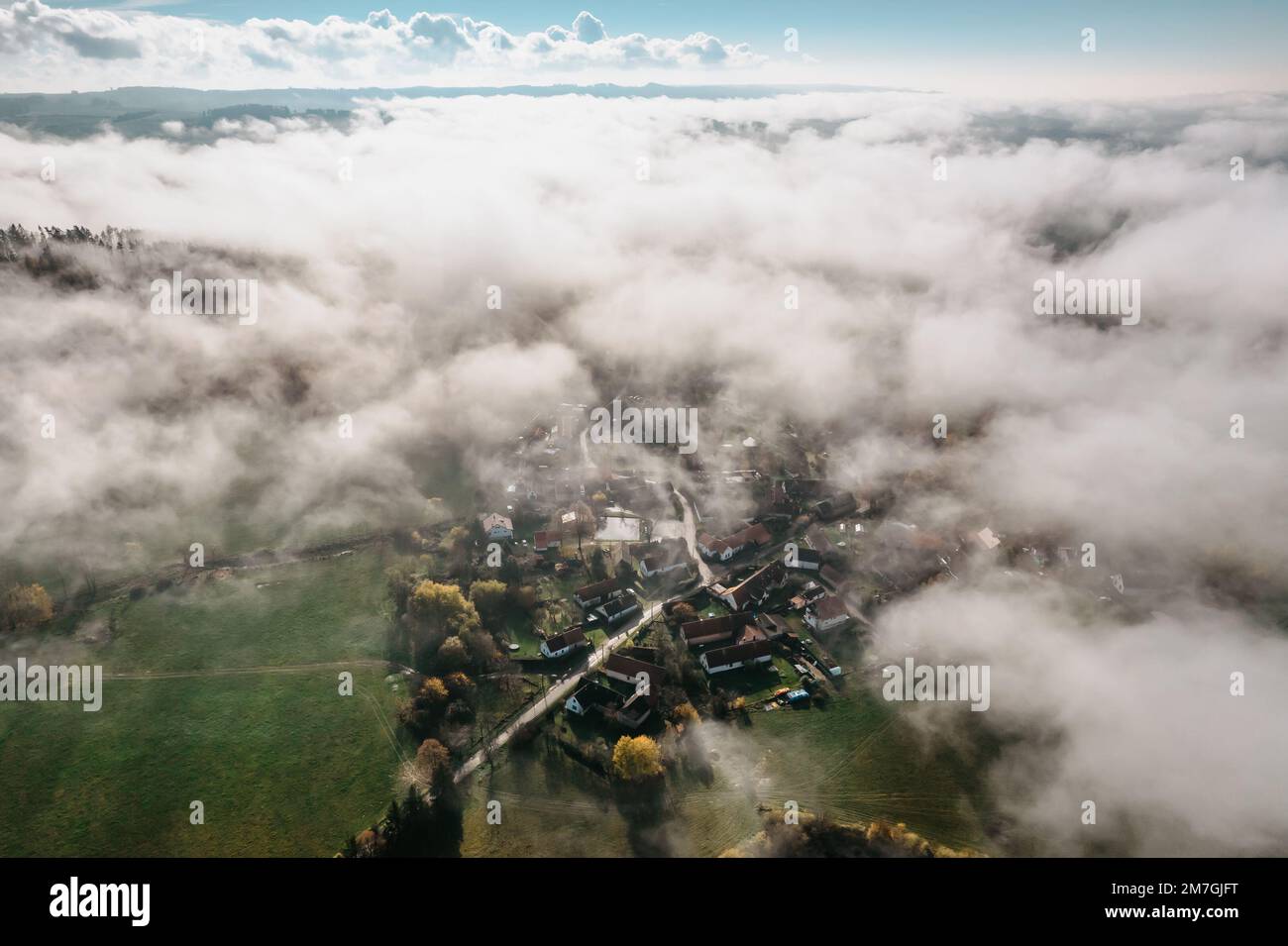 Aerial view of small village in fog.Top view of traditional housing ...