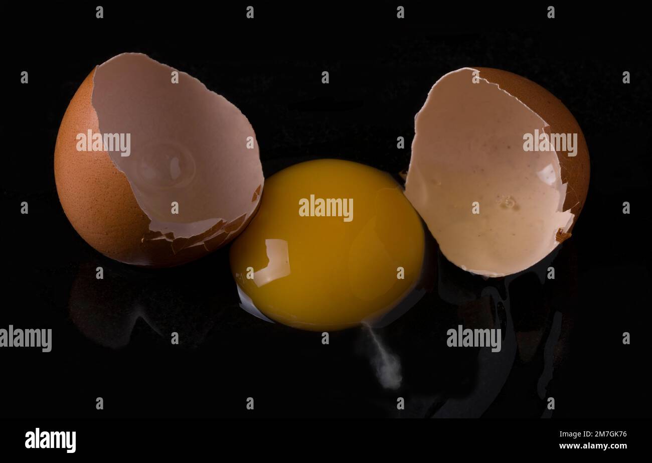 Raw Egg Cracked Open Shell Yolk Stock Photo - Alamy