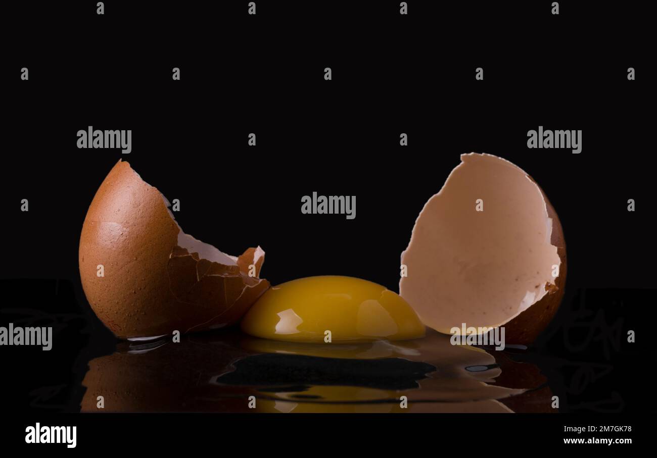 Raw Egg Cracked Open Shell Yolk Stock Photo - Alamy