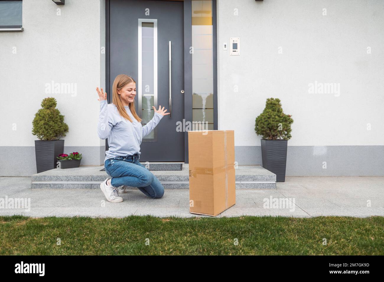 Woman gets overly excited when she sees the cardboard box waiting for ...