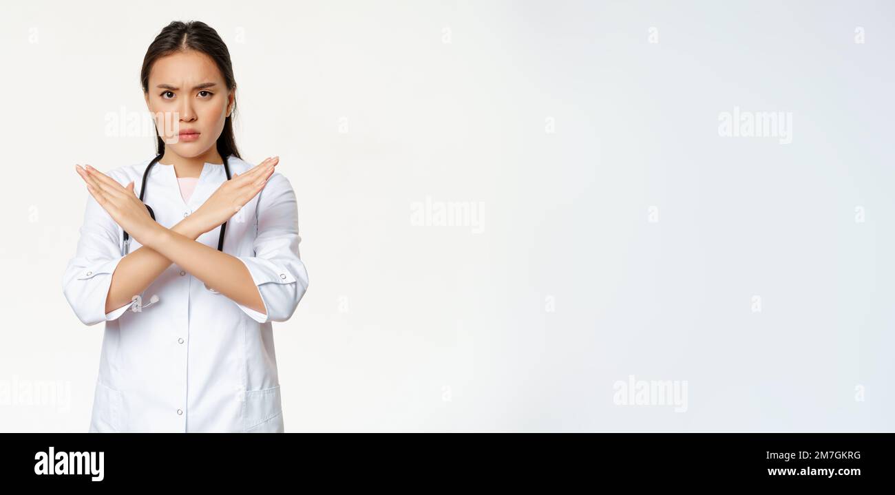 Serious asian woman doctor prohibit patient behaviour, showing stop ...