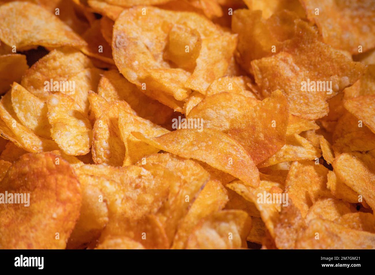tasty crispy potato chips background Stock Photo - Alamy