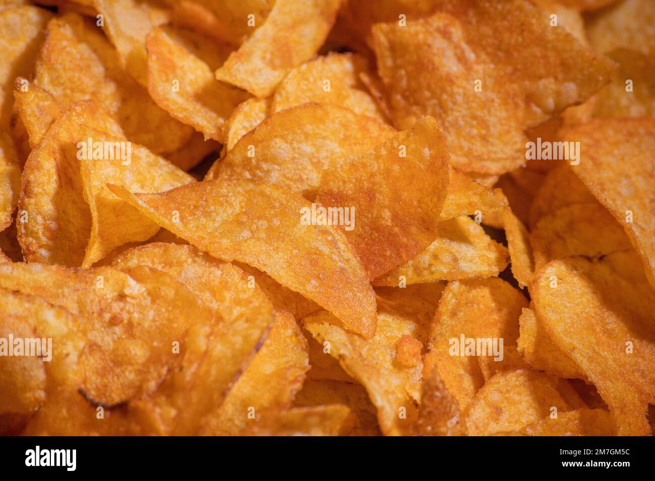 tasty crispy potato chips background Stock Photo - Alamy