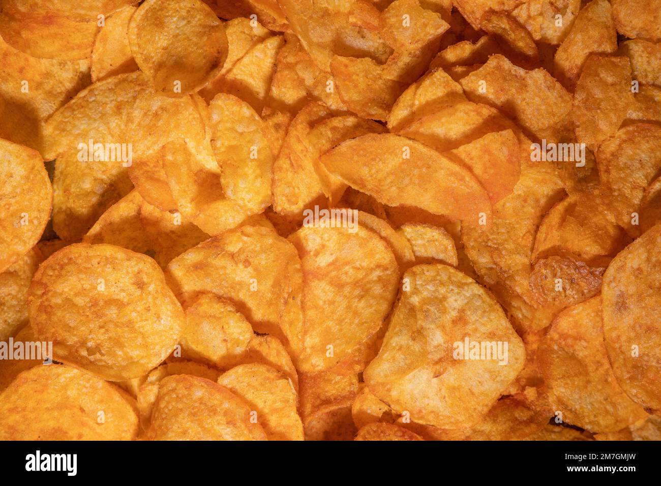 tasty crispy potato chips background Stock Photo - Alamy