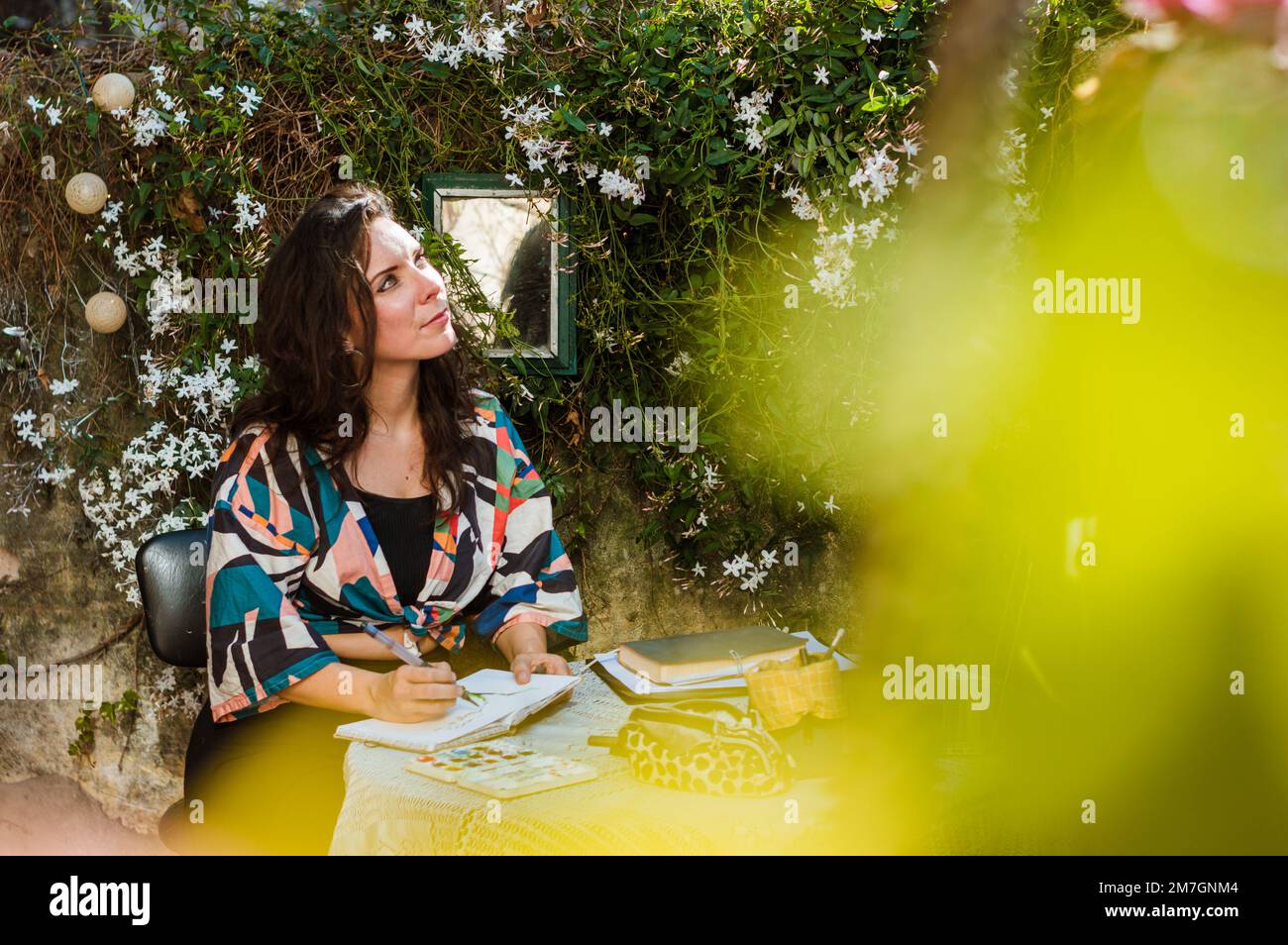 Caucasian adult artist woman of French ethnicity drawing with ...