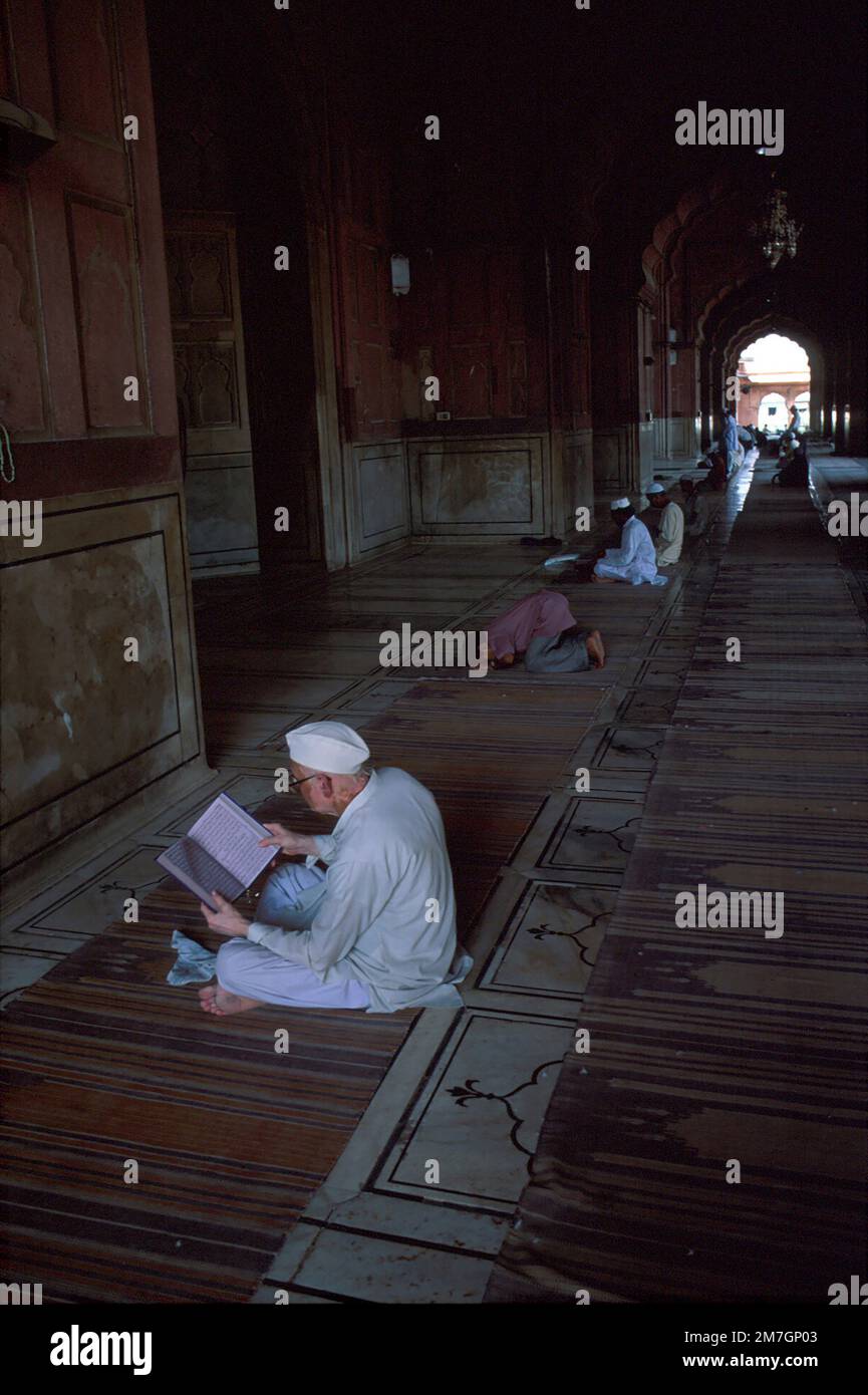 Man reading from Koran, Jama Masjid Mosque, Old Delhi, New Delhi, India ...