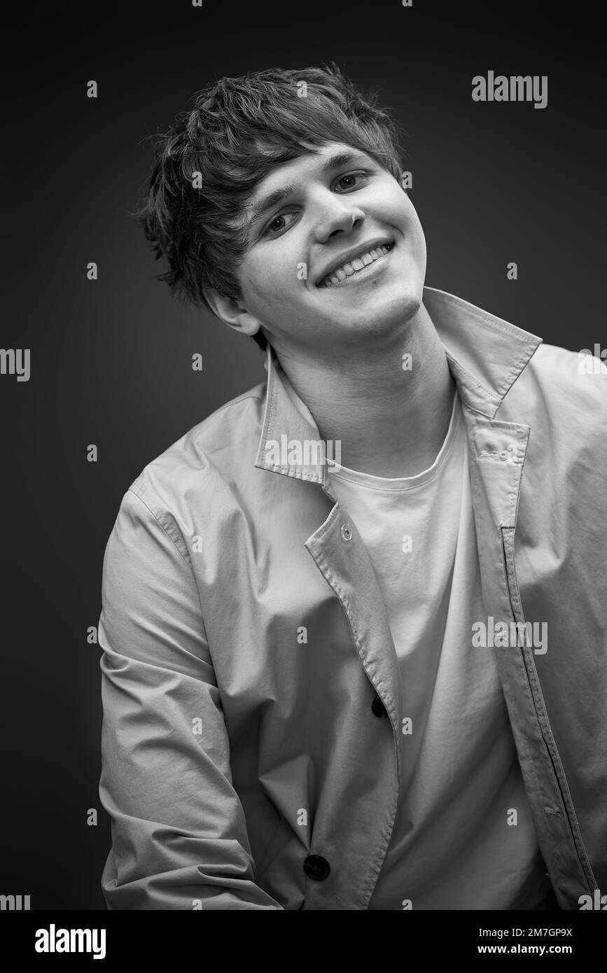 portrait of caucasian man with hairstyle in coat Stock Photo - Alamy