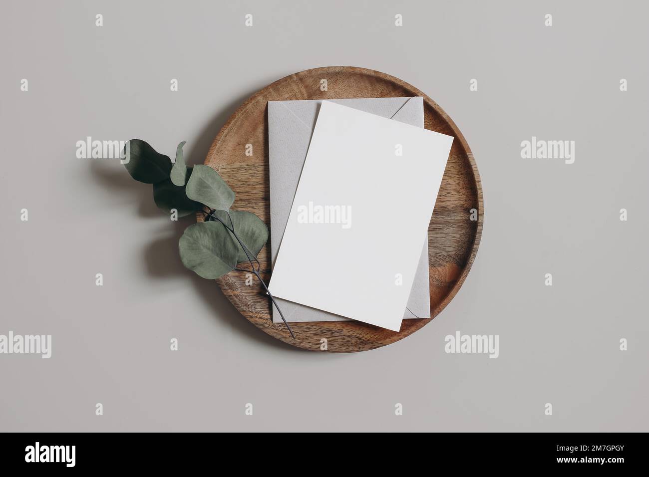 Blank greeting card, invitation and envelope mockup. Wooden plate, tray ...