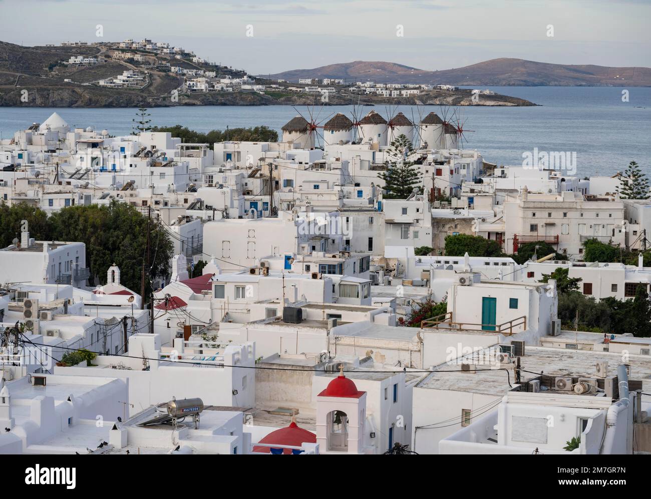 View over the white Cycladic houses of Mykonos town with windmills ...