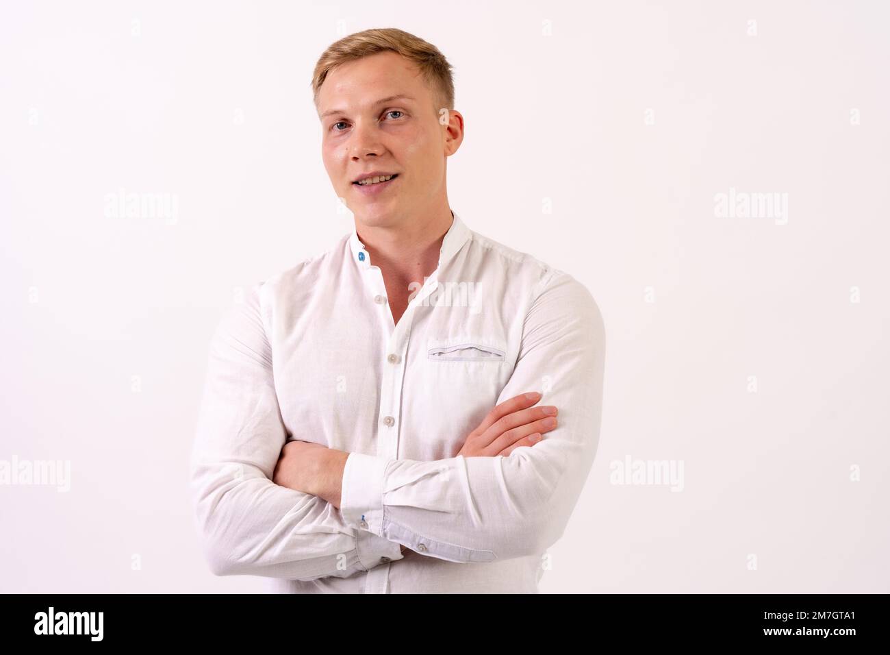 Caucasian businessman man in a white shirt smiling on a white ...