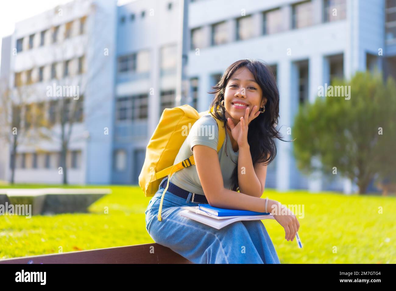 Asian girl on campus, student enjoying classes, smiling at university ...