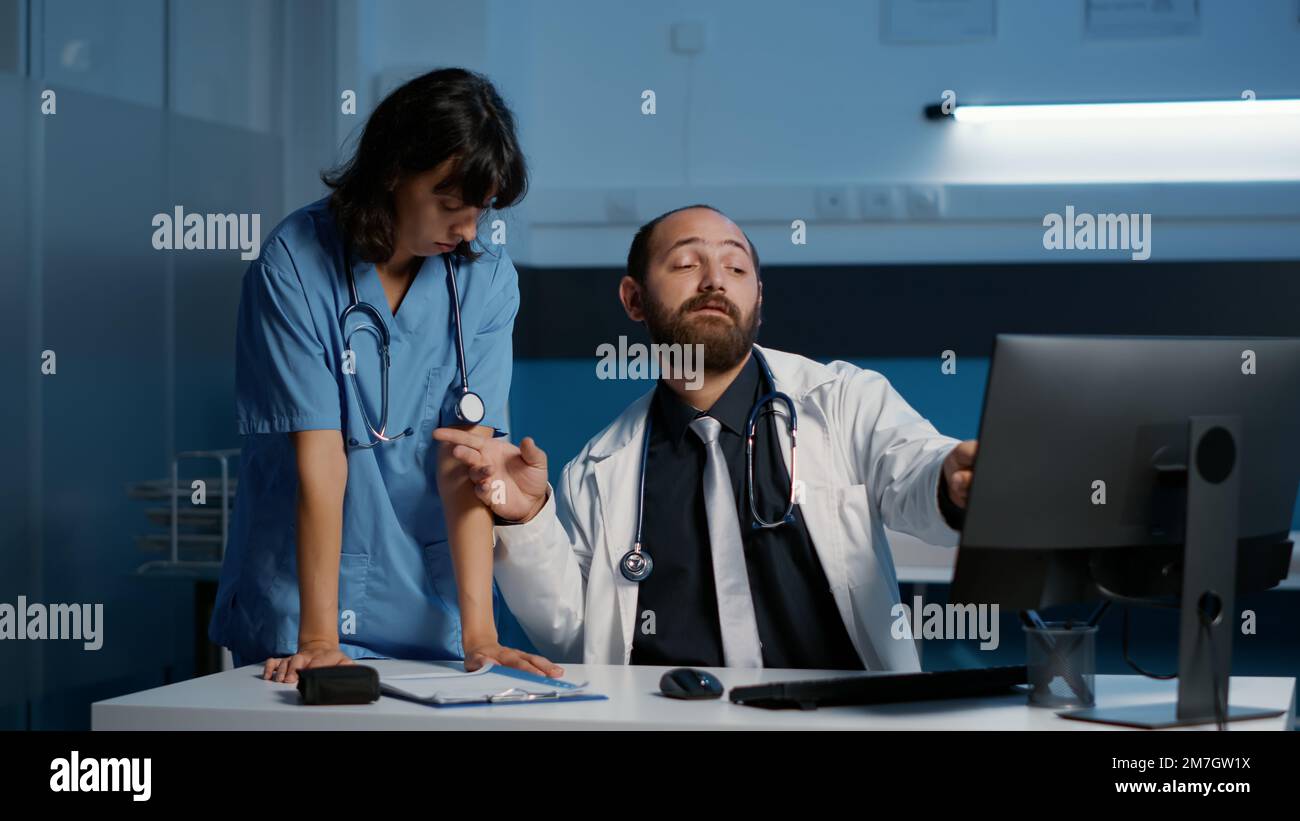 Medical assistant working over hours while being touched ...