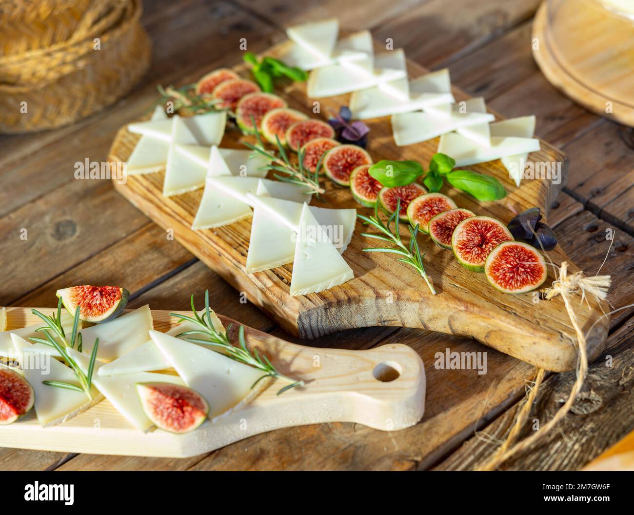Goat cheese slices for tasting with figs and herbs Stock Photo - Alamy