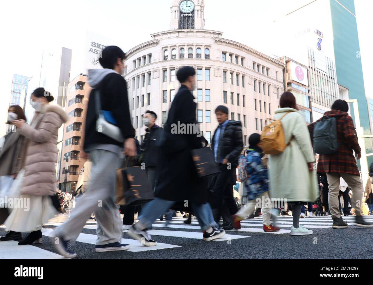 Tokyo, Japan. 9th Jan, 2023. People cross a street at Ginza fashion ...