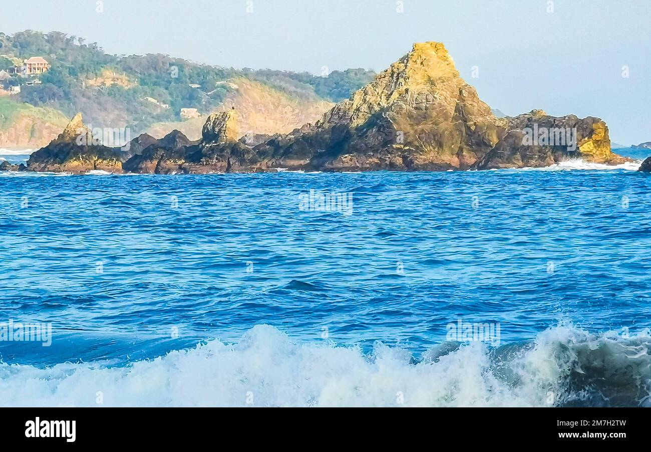 Beautiful paradise beach with mountains cliffs rocks high waves and ...