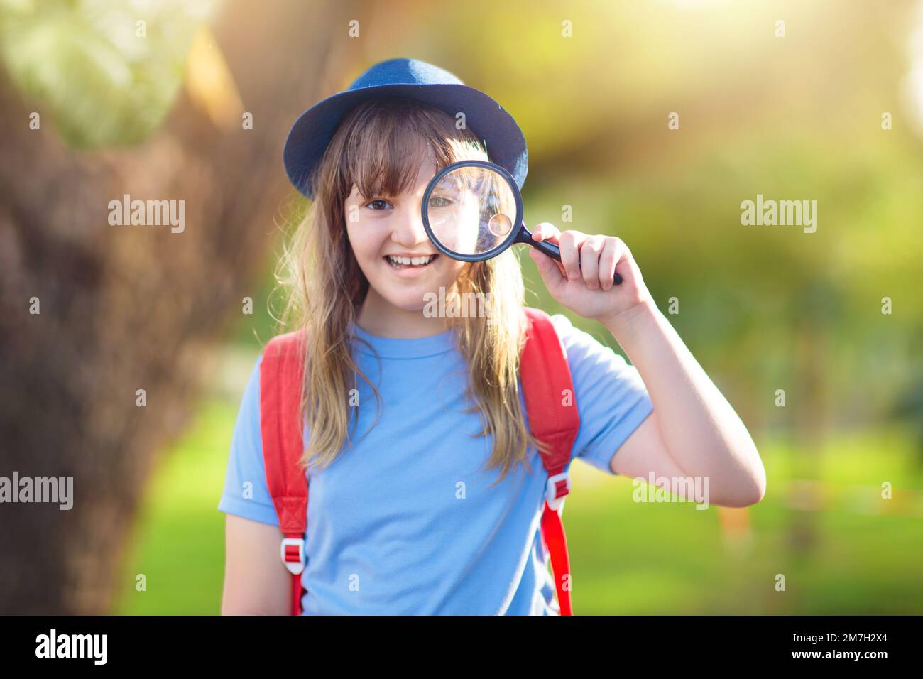 Kids explore nature. Children hike in sunny summer park. Scout club and ...