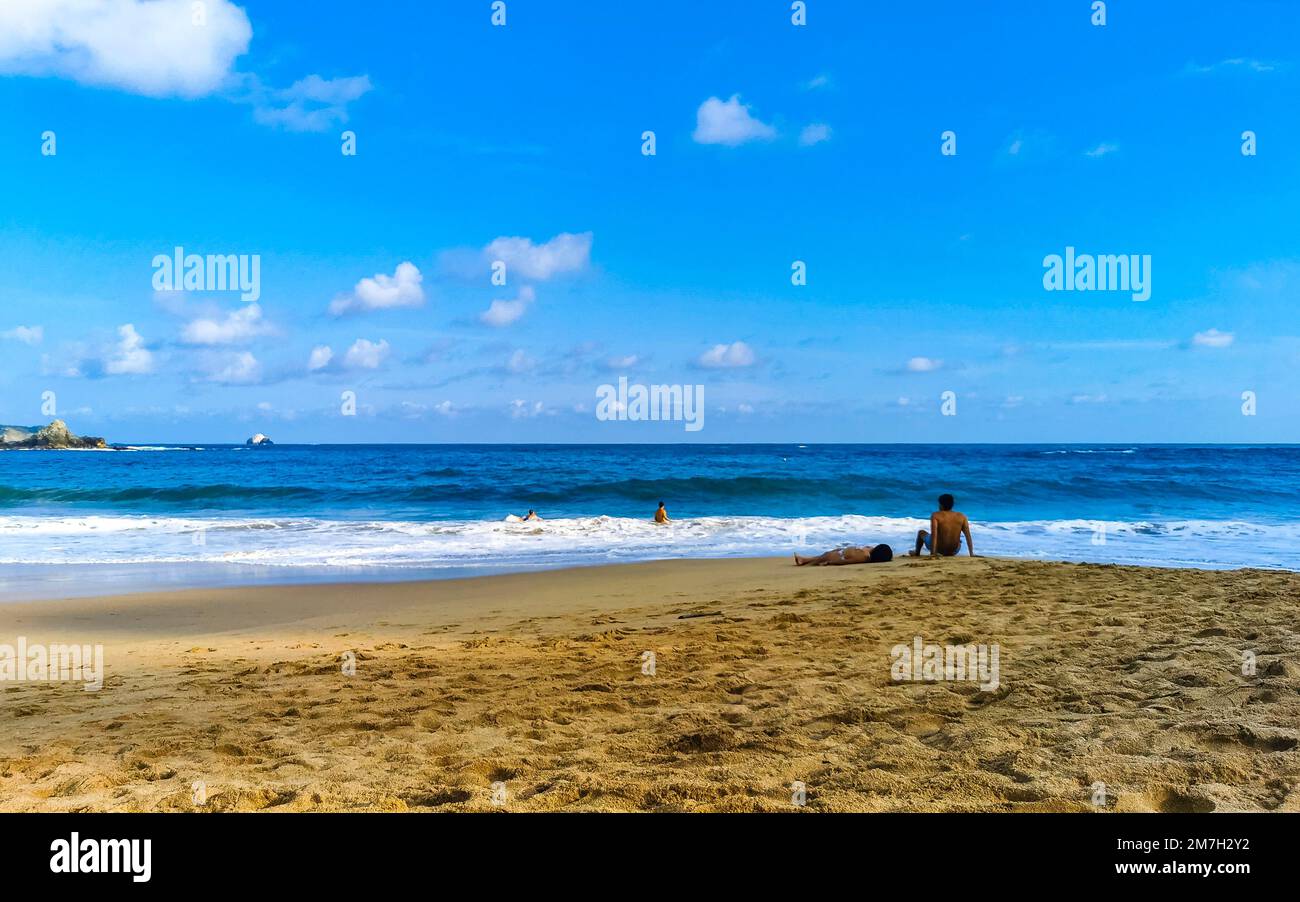 Beautiful paradise beach with mountains cliffs rocks high waves and ...