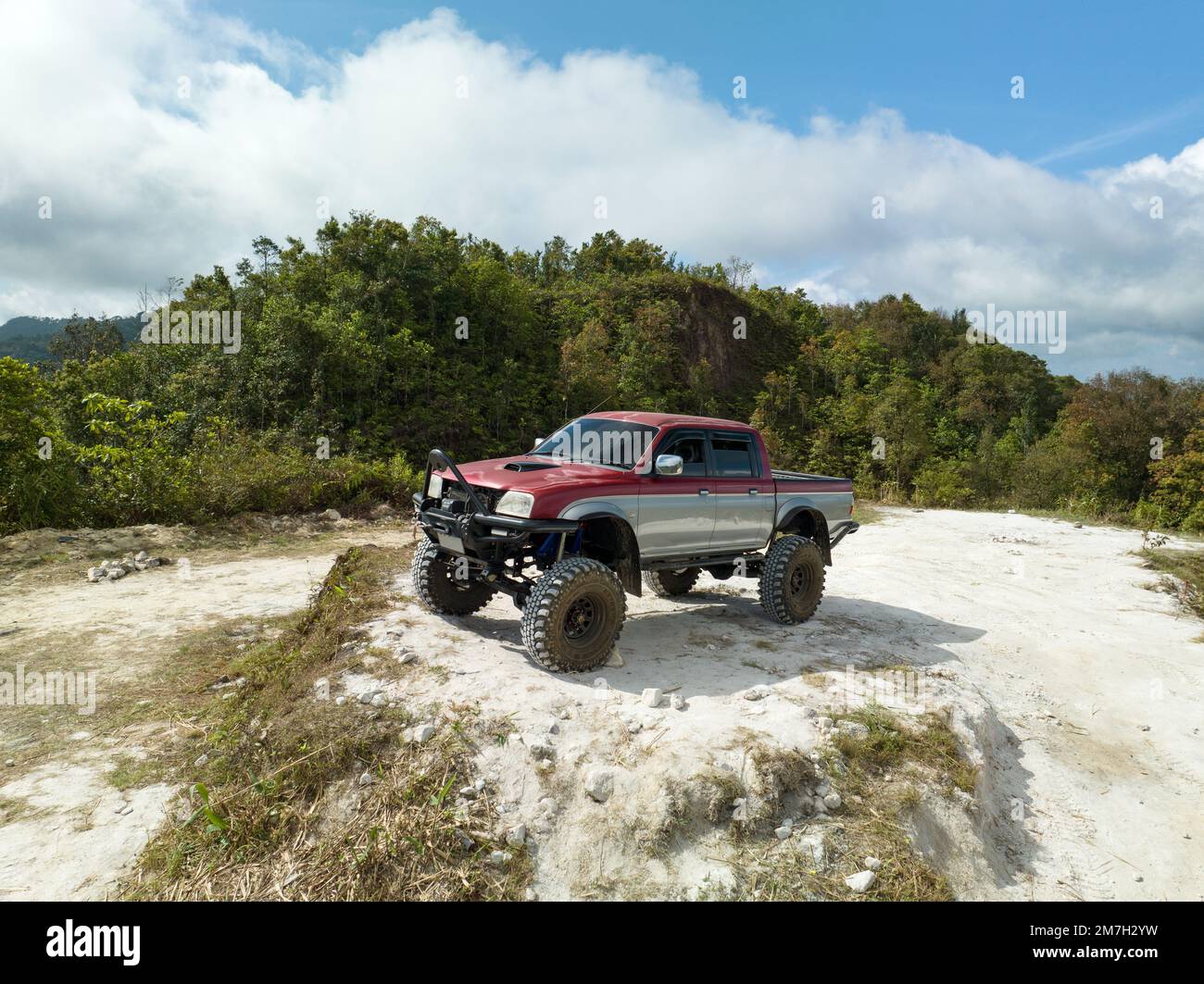 Red 4x4 car on high mountain at Phutajor Mountain unseen travel people ...